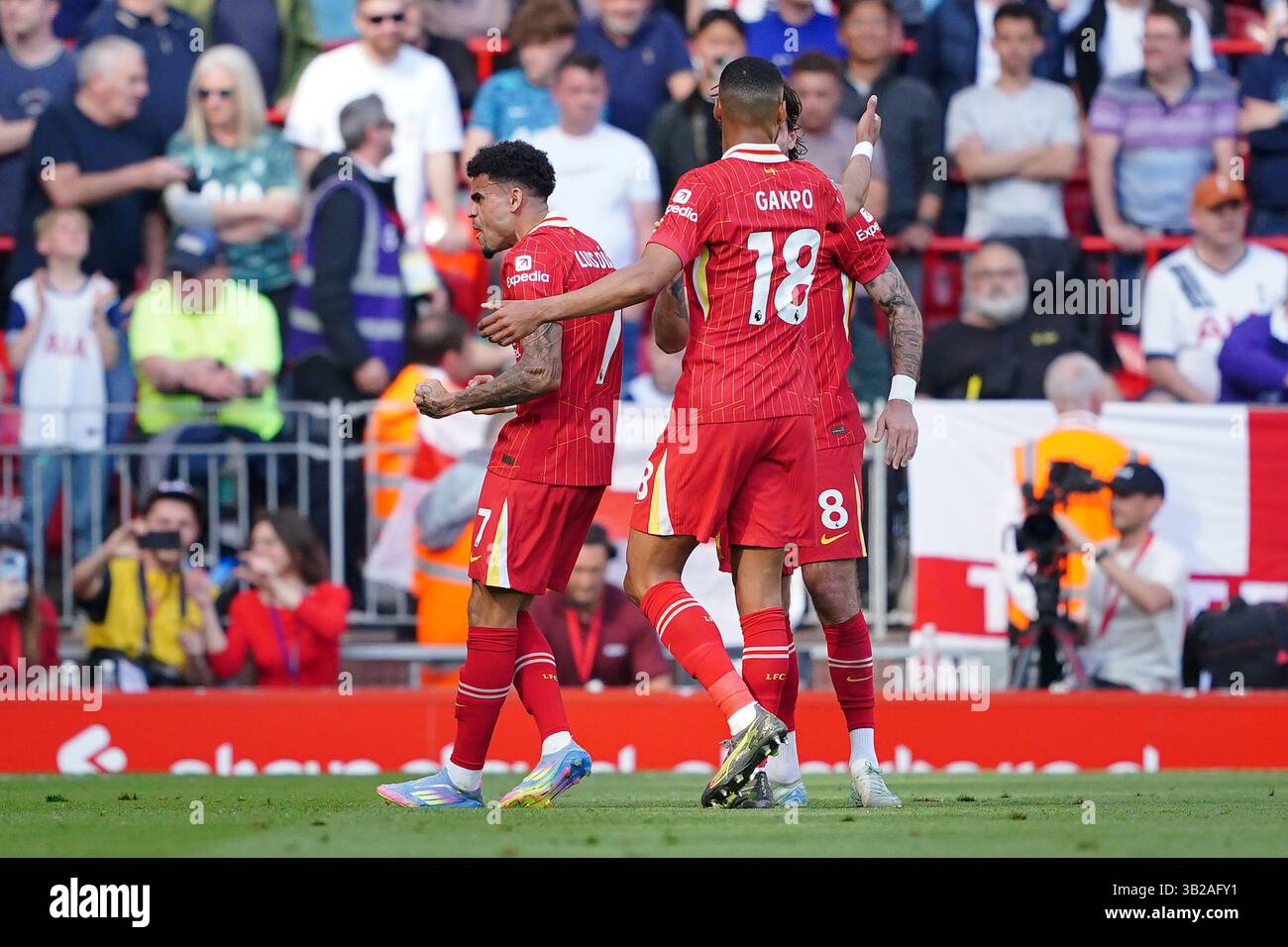 Liverpool's Luis Diaz (left) celebrates scoring their side's first goal ...