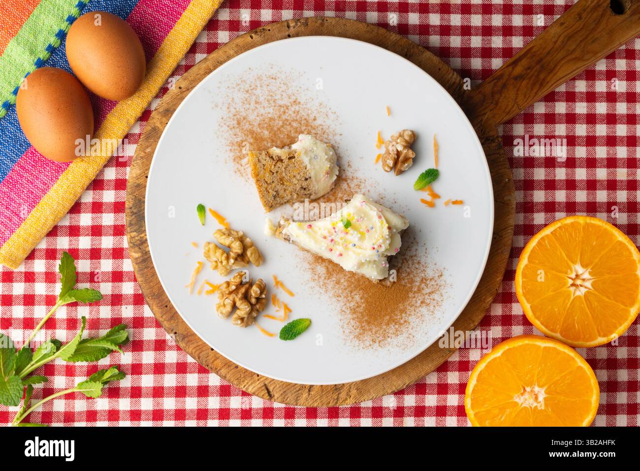 Carrot and walnut cake with cream cheese frosting. Top view table with ...