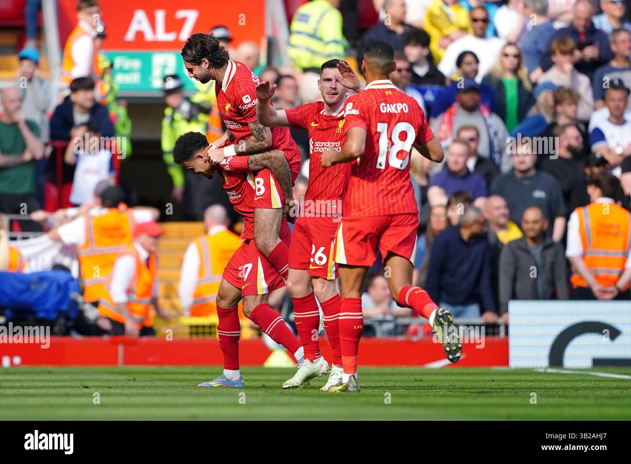 Liverpool's Luis Diaz (left) celebrates scoring their side's first goal ...