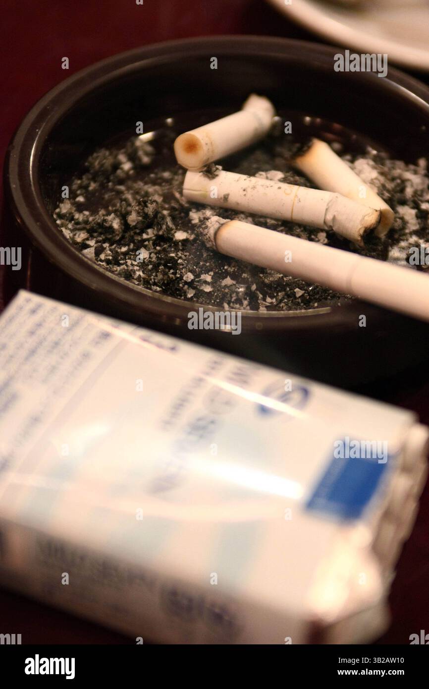 Dec 23, 2009 - Tokyo, Japan - Cigarette butts sit in an ash tray. Japan ...