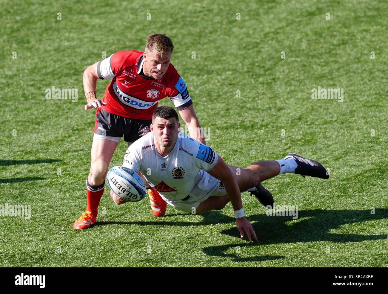 Exeter Chiefs' Will Rigg (right) is tackled by Gloucester's Gareth ...