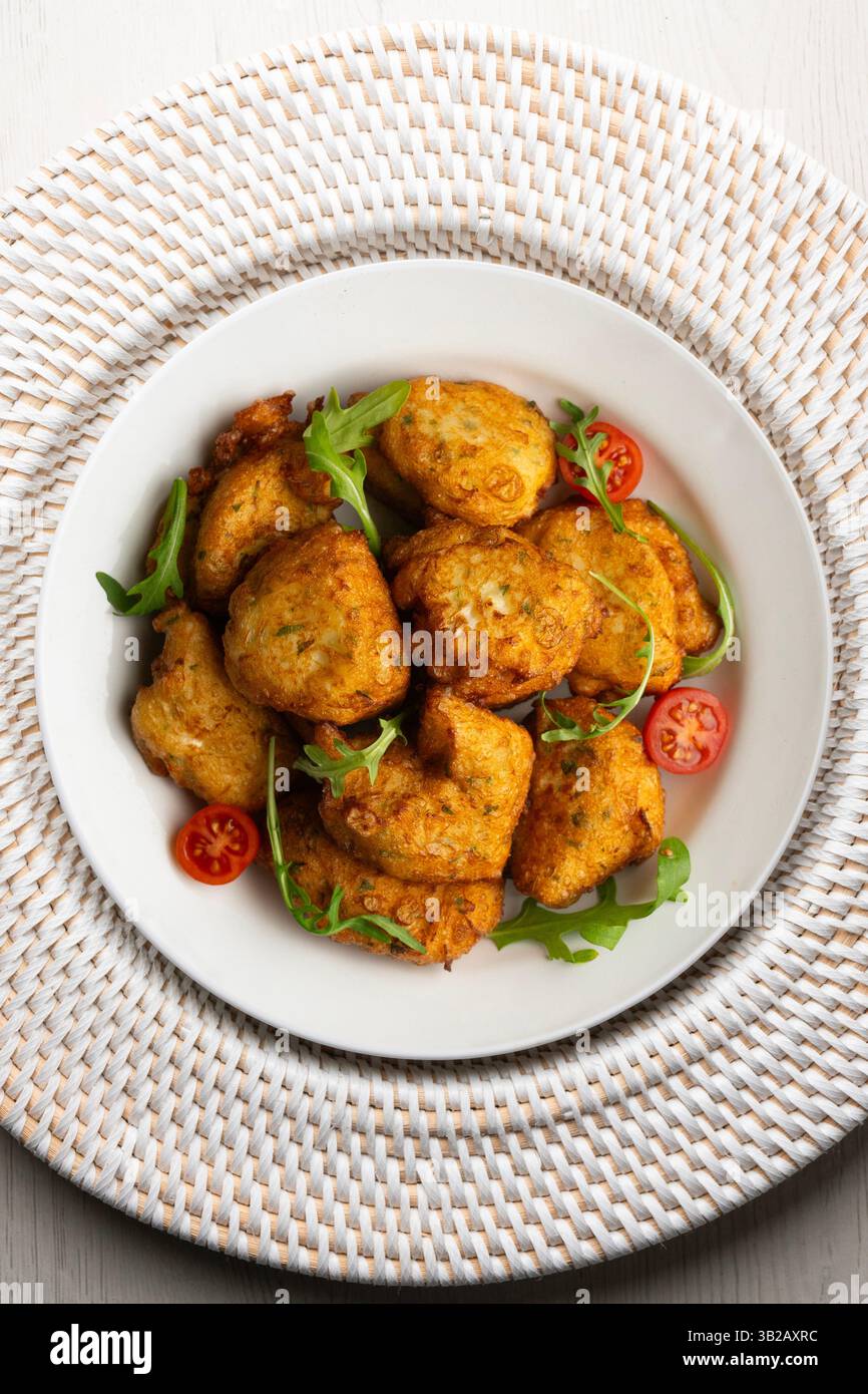 Cod fritters, a traditional Spanish tapa. Top view table with christmas ...