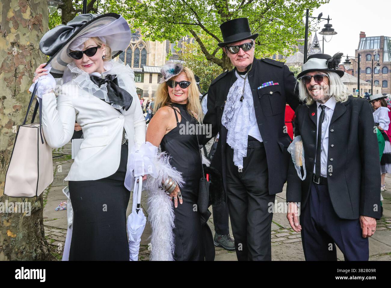 London, UK. 27th Apr, 2025. An elegant group in black and white outfits ...