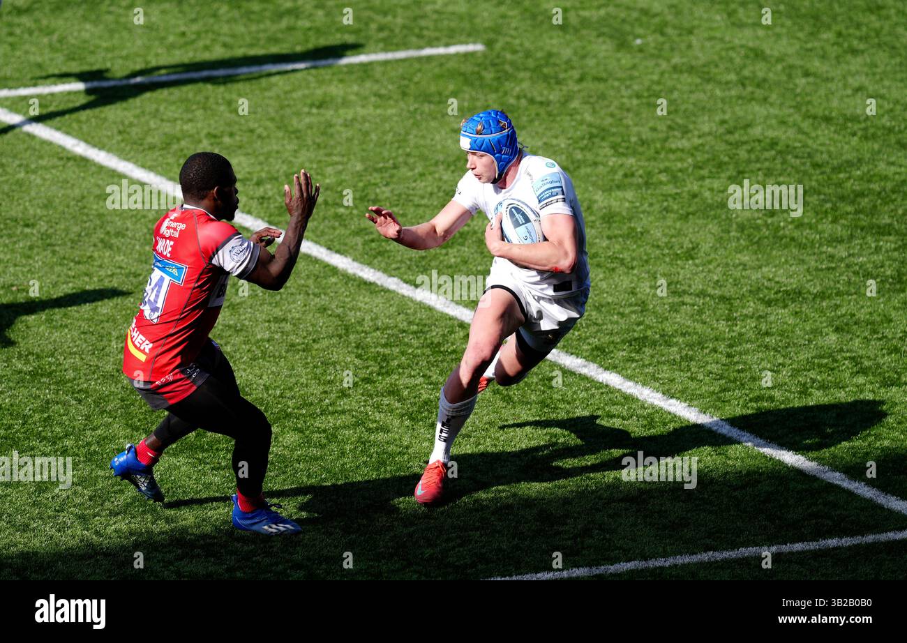 Exeter Chiefs' Josh Hodge (right) is tackled by Gloucester's Christian ...