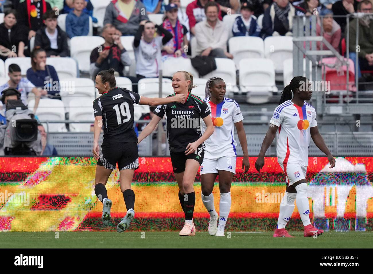 Arsenal's Caitlin Foord, left, and Frida Maanum celebrate after Lyon ...