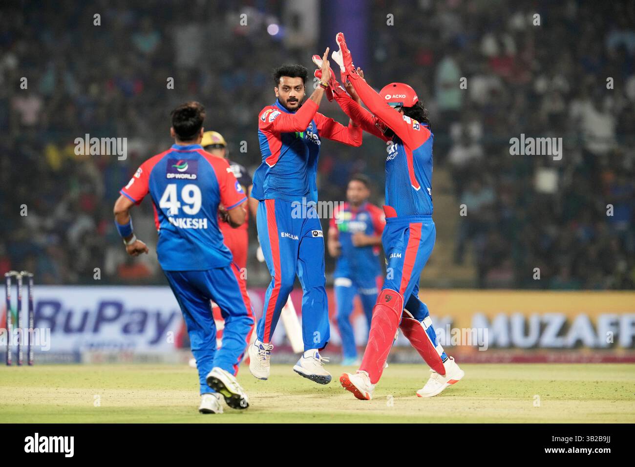 Delhi Capitals' captain Axar Patel, center left, celebrates with ...