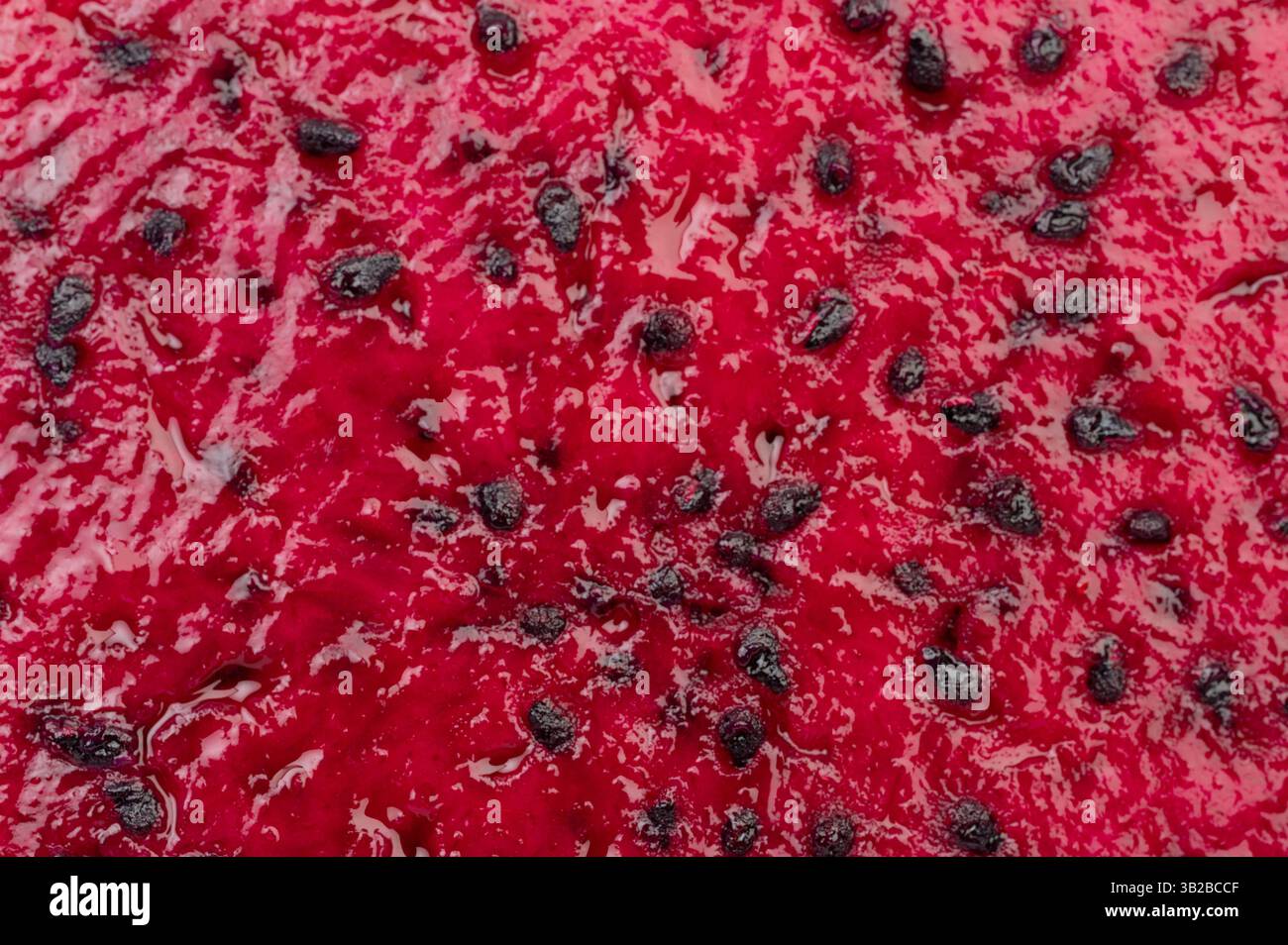 Red pulp with black small seeds texture of pitaya fruit cut Stock Photo ...