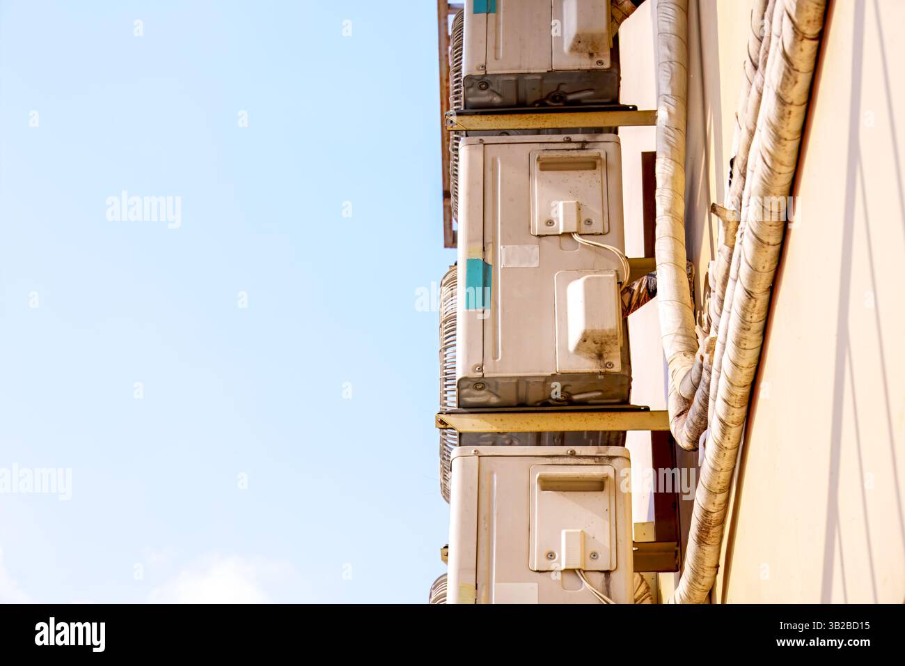Stacked Air Conditioning Units on a Building Exterior in Daylight Stock ...