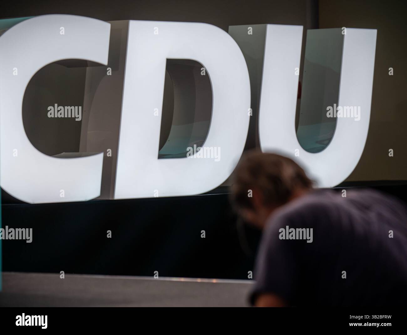 27 April 2025, Berlin: Employees prepare the hall for the CDU Federal ...