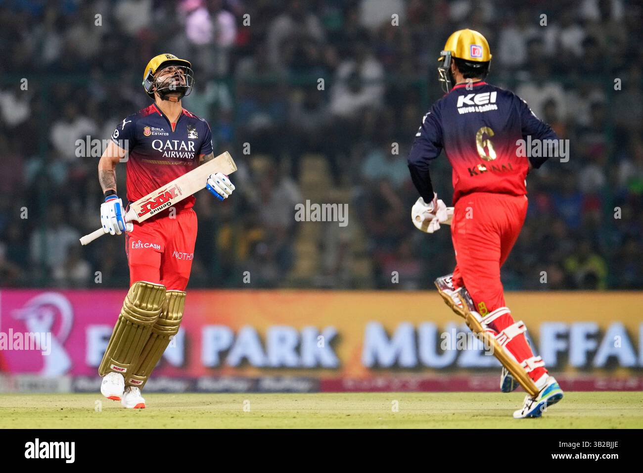 Royal Challengers Bengaluru's Virat Kohli, left, reacts after playing a ...