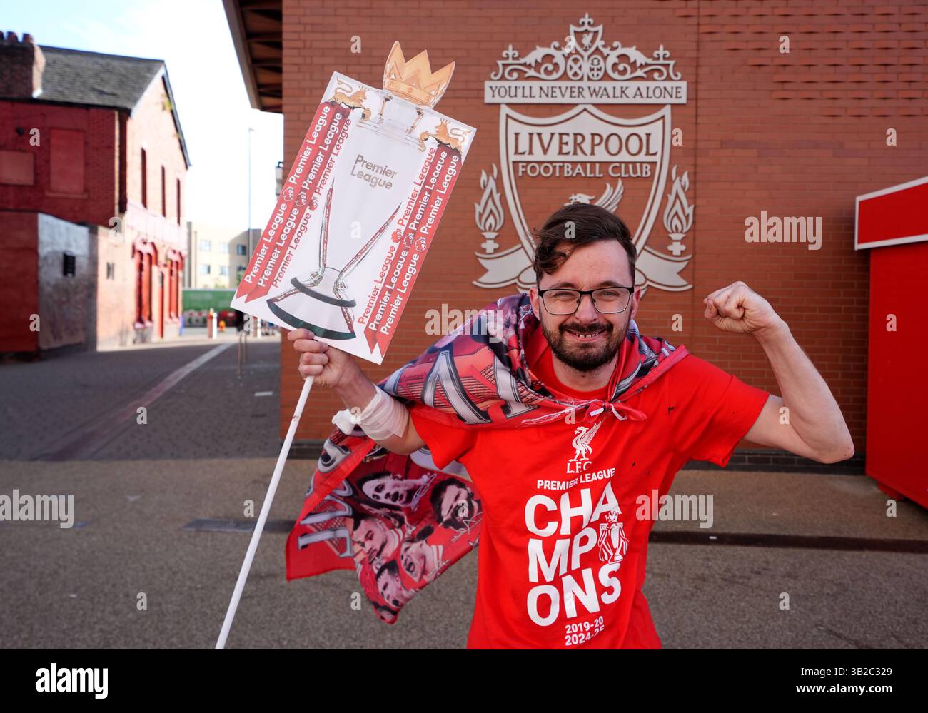 A Liverpool fan outside the ground during the Premier League match at ...