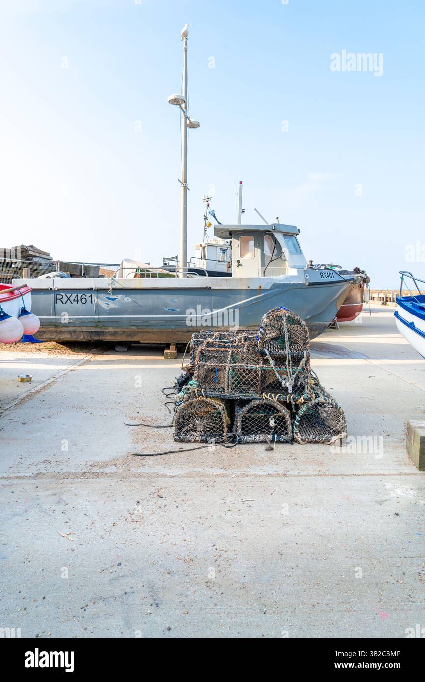 Stack of Lobster pot traps between boats Stock Photo - Alamy