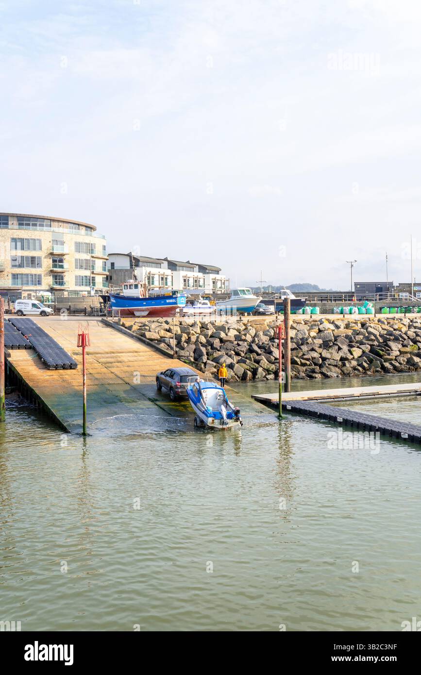 Launching a boat on a slipway Stock Photo - Alamy