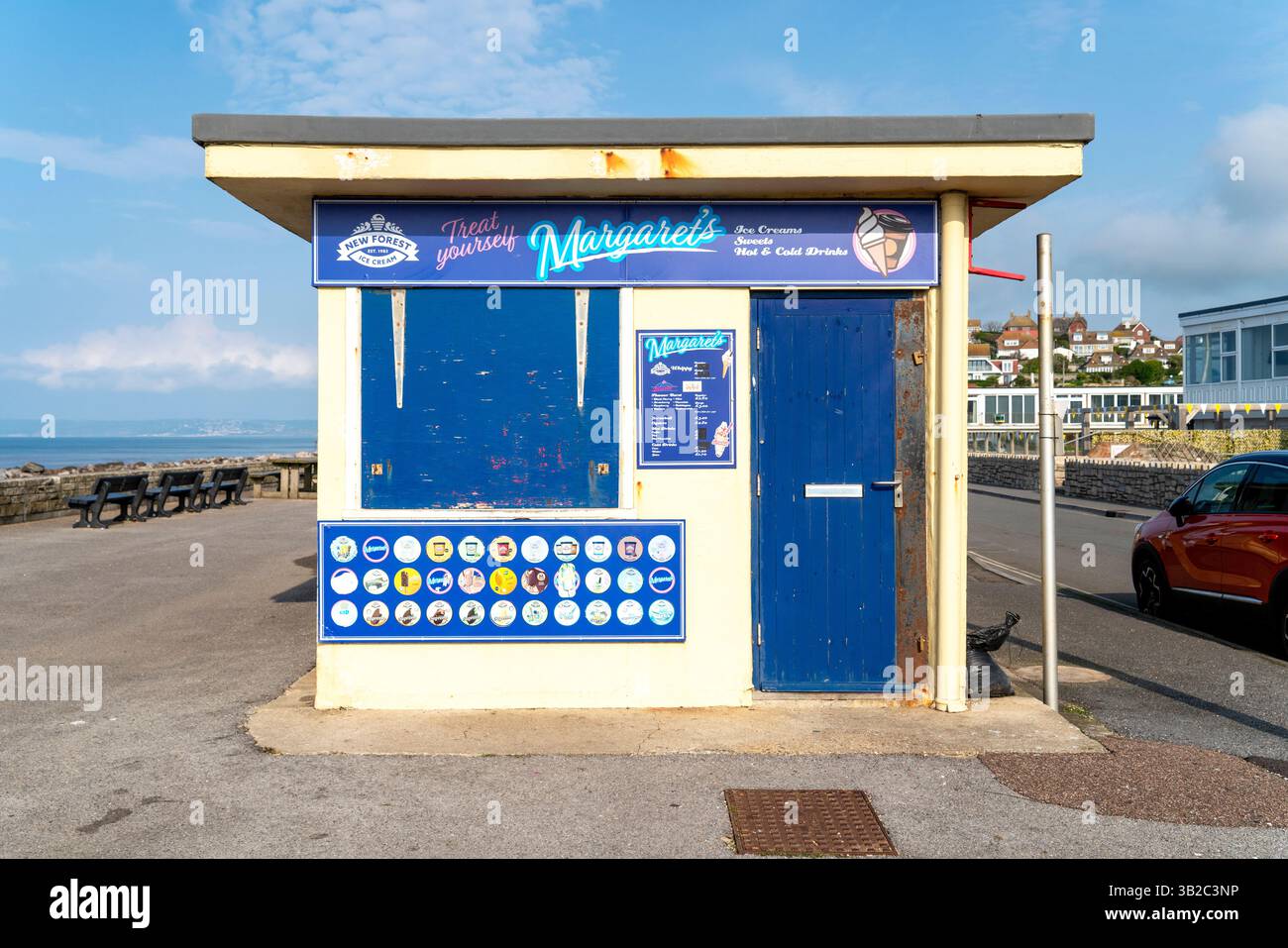 Closed ice cream sales kiosk at West Bay Beach Dorset UK Stock Photo ...
