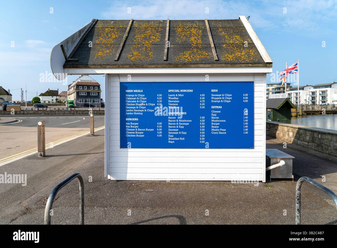 Food menu board on the side of a seaside town kiosk Stock Photo - Alamy