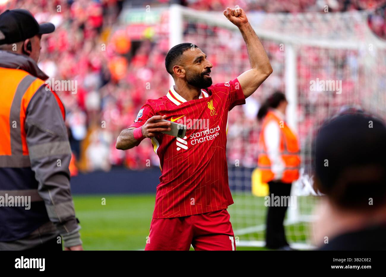 Liverpool's Mohamed Salah celebrates scoring their side's fourth goal ...