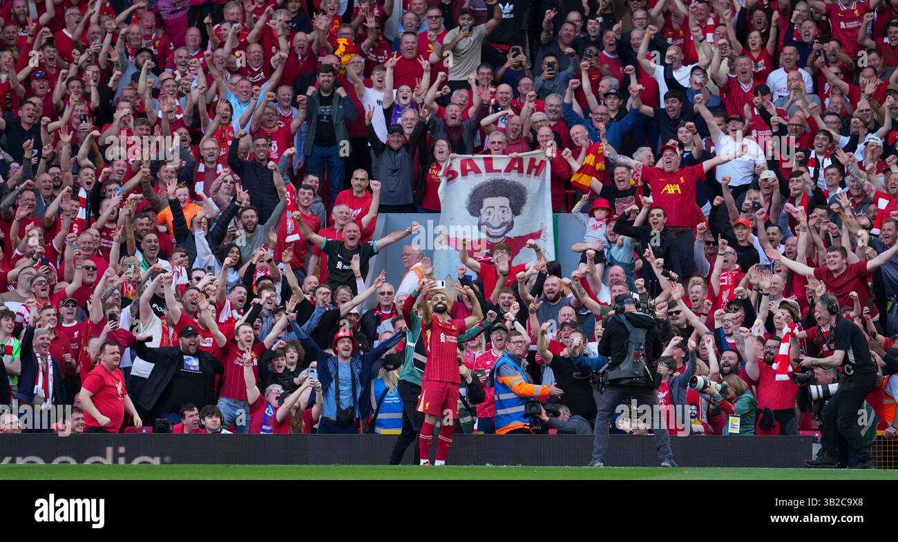 Liverpool's Mohamed Salah takes a selfie with a fans smartphone as he ...