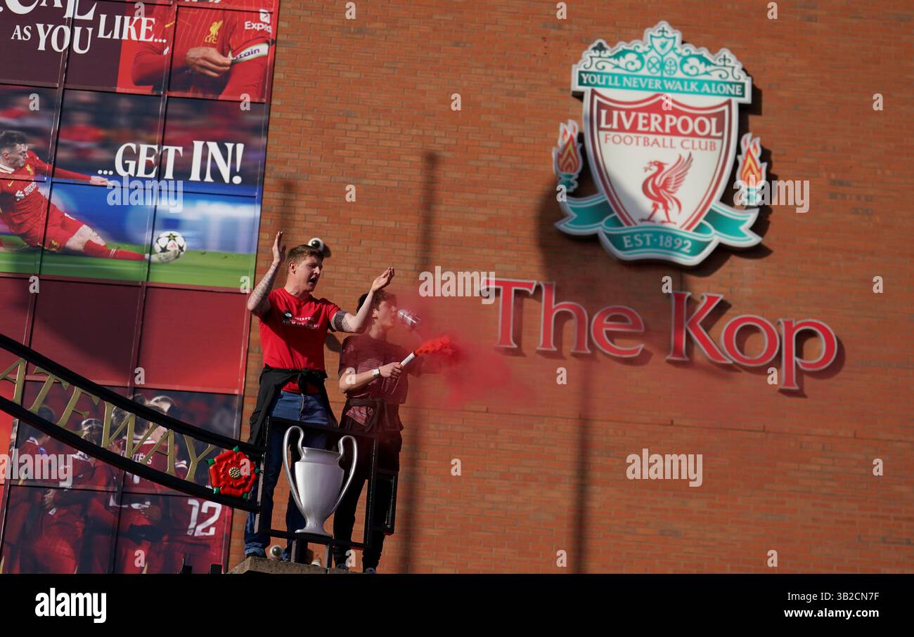 Liverpool fans celebrate victory in the Premier League outside Anfield ...