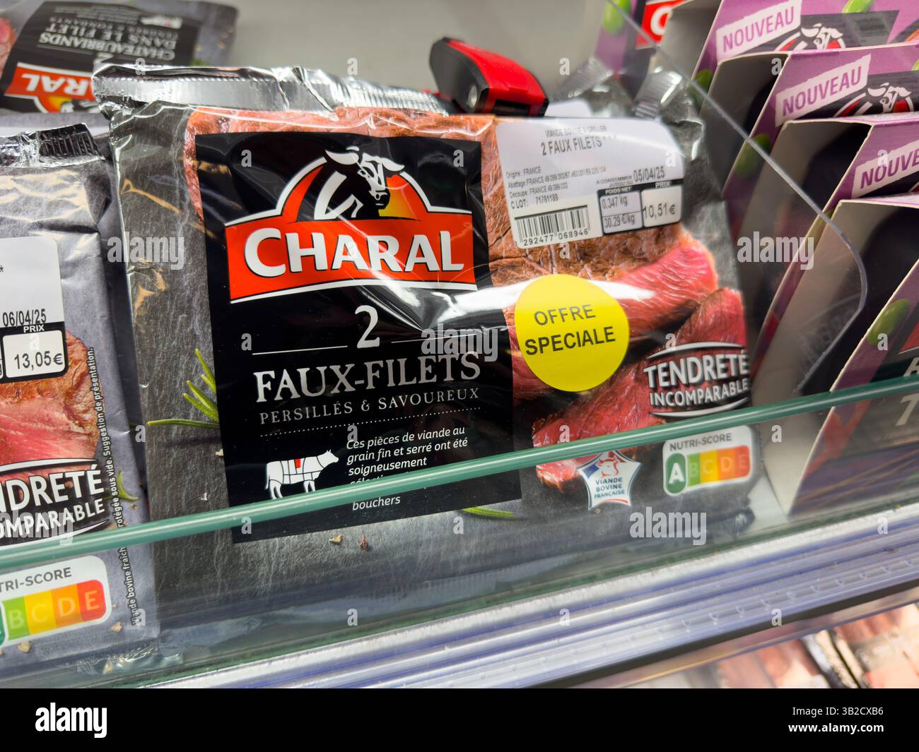 Unique cuts of faux-filets displayed attractively in a modern grocery ...