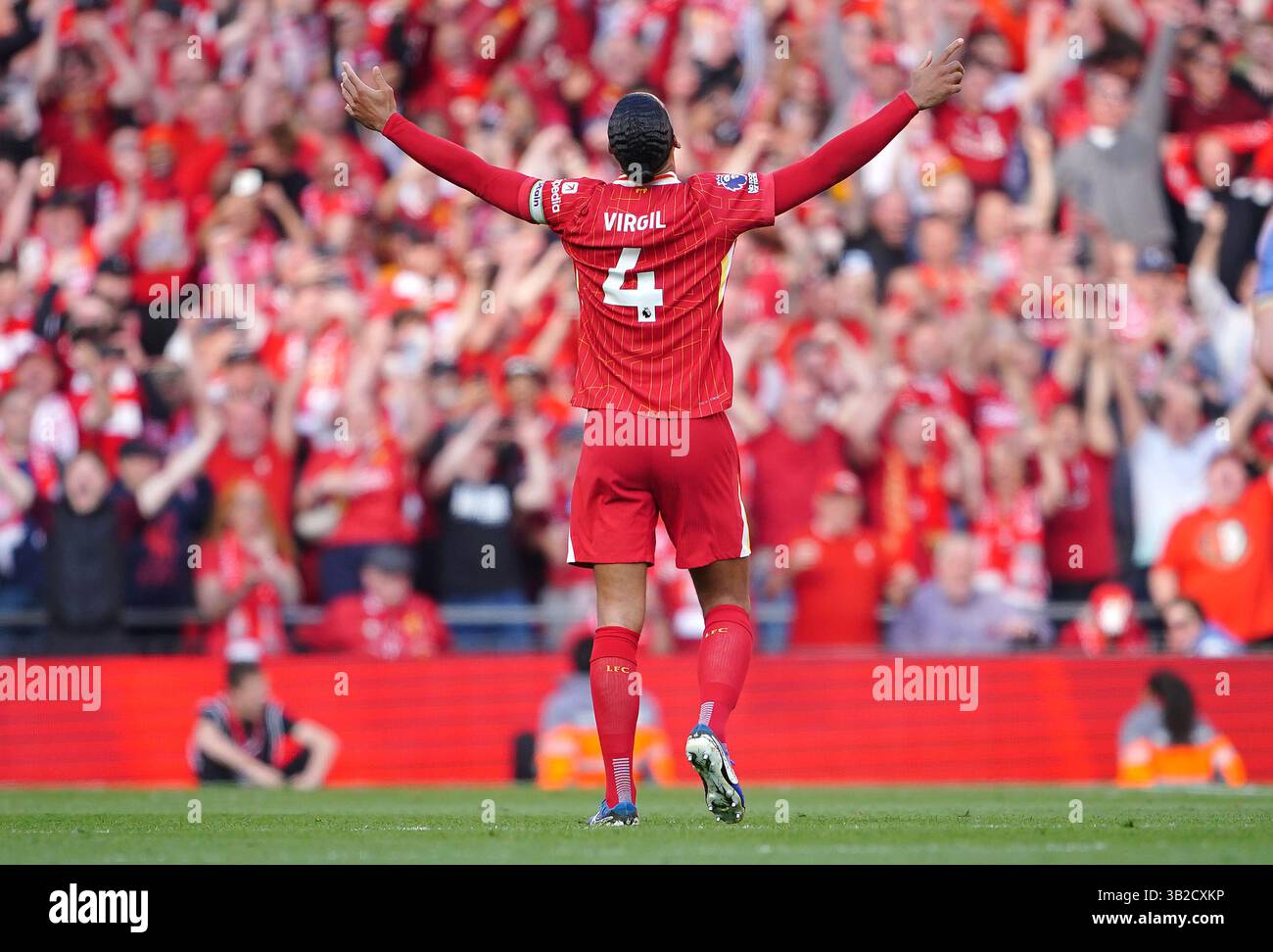 Liverpool's Virgil van Dijk celebrates victory and the Premier League ...