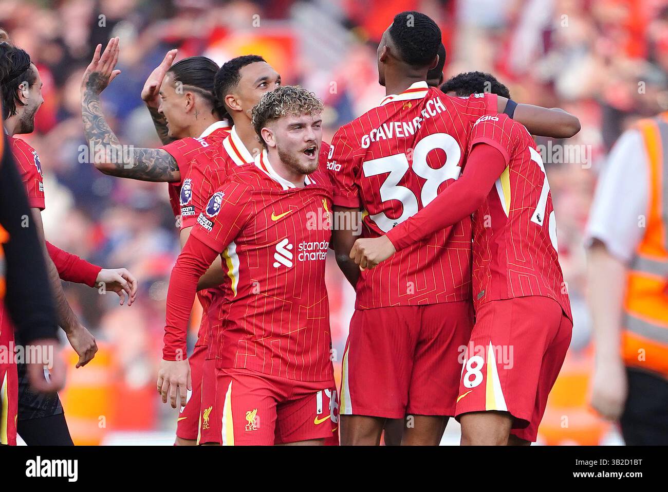 Liverpool players celebrate victory and the Premier League title ...