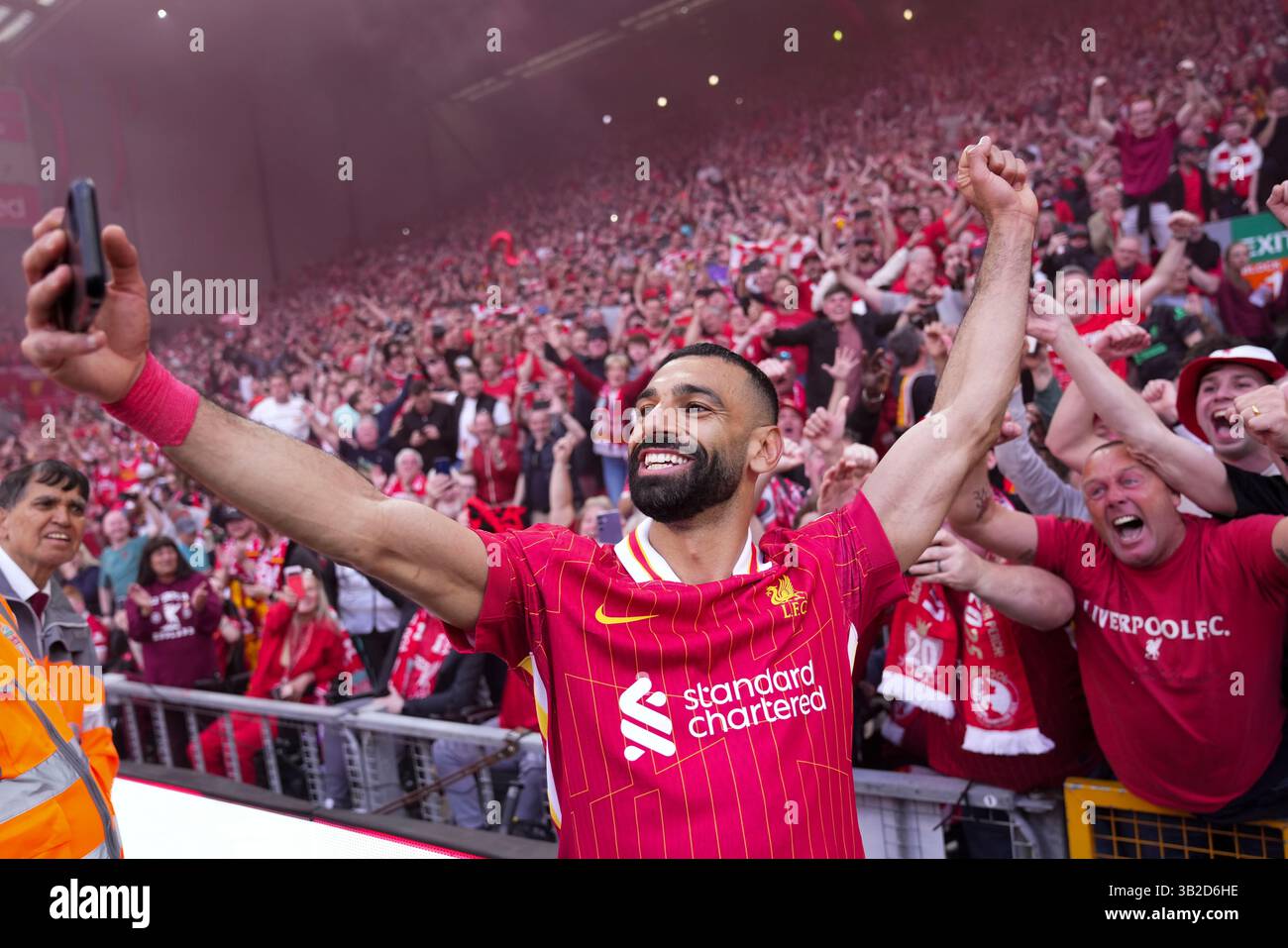 Liverpool's Mohamed Salah celebrates by taking a selfie after winning ...