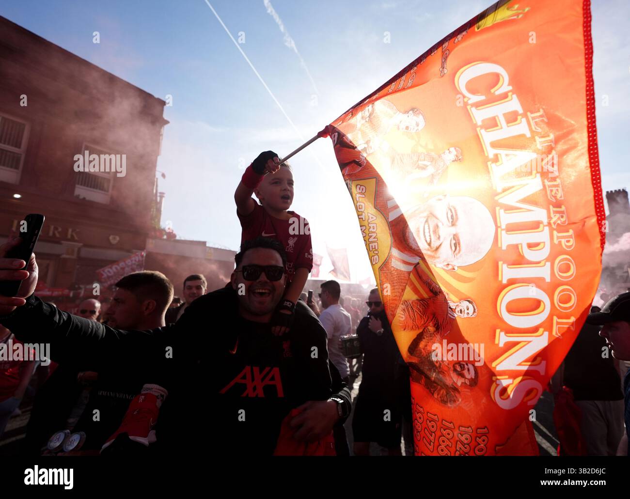 Liverpool fans celebrate victory in the Premier League outside Anfield ...