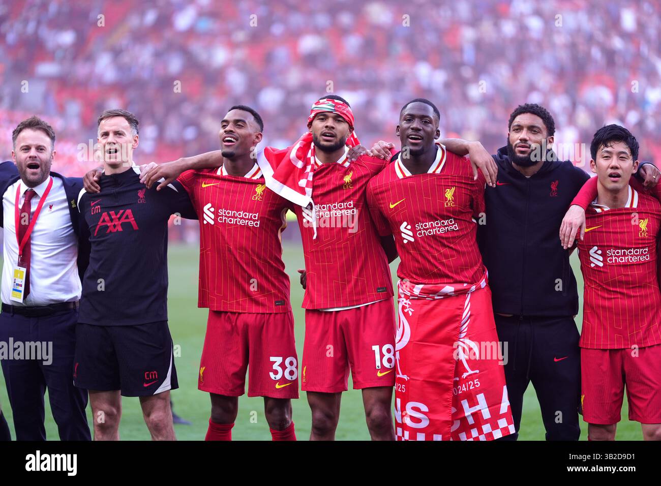 Liverpool players and staff members celebrate victory and the Premier ...