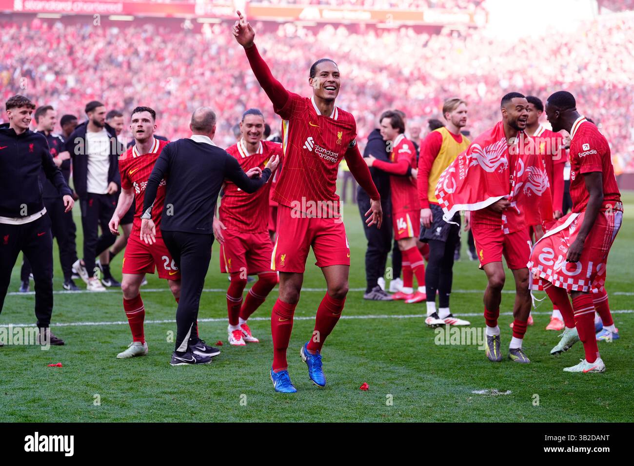 Liverpool's Virgil van Dijk (centre) and team-mates celebrate victory ...
