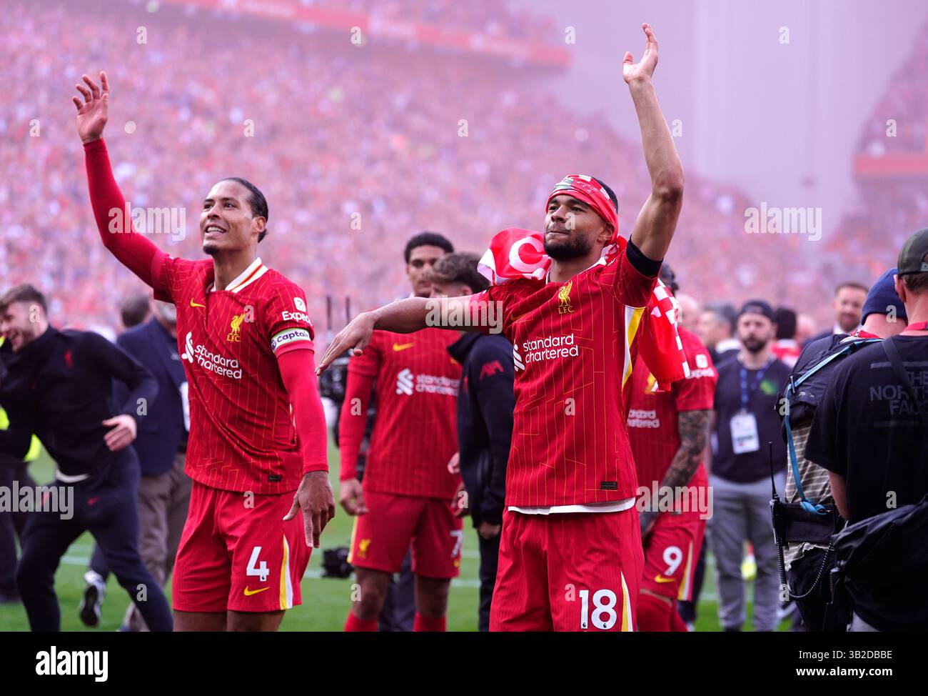 Liverpool's Virgil van Dijk (left) and Cody Gakpo celebrate victory and ...
