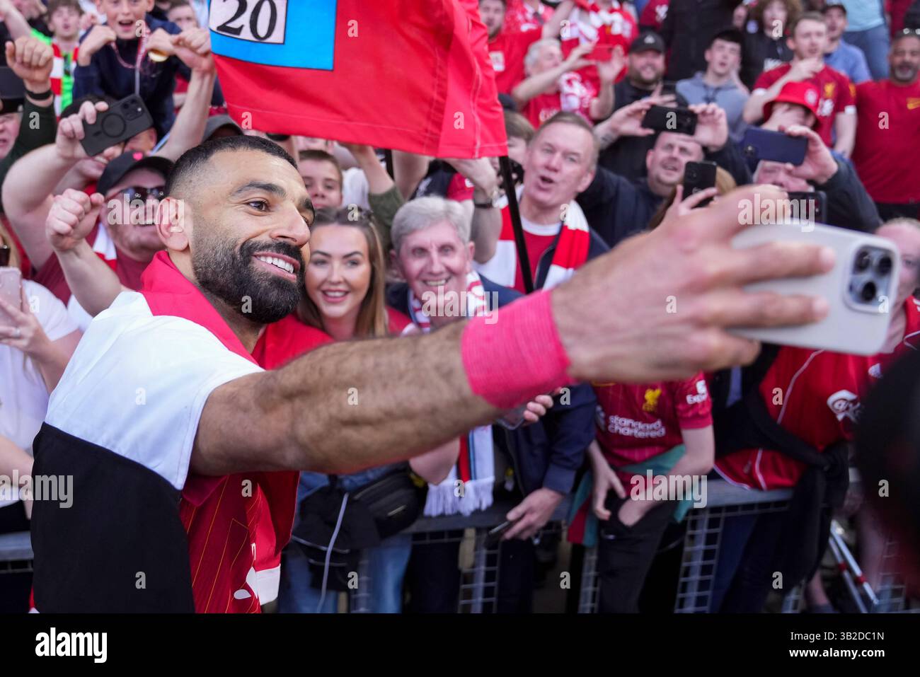 Liverpool's Mohamed Salah celebrates by taking a selfie after winning ...