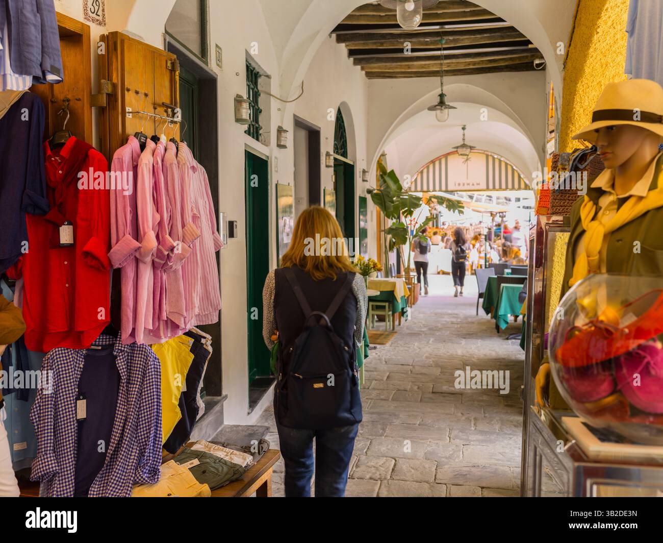 Portofino, Italy - April 26, 2025: Woman shopping through the arcades ...