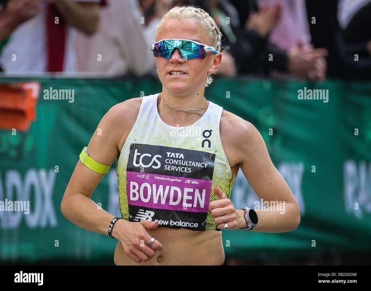 London, UK, 27th April 2025. The race route and spectators are reflected in British elite runner ...