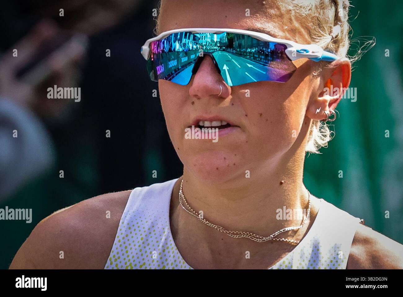 London, UK. 27th Apr, 2025. The race route and spectators are reflected ...