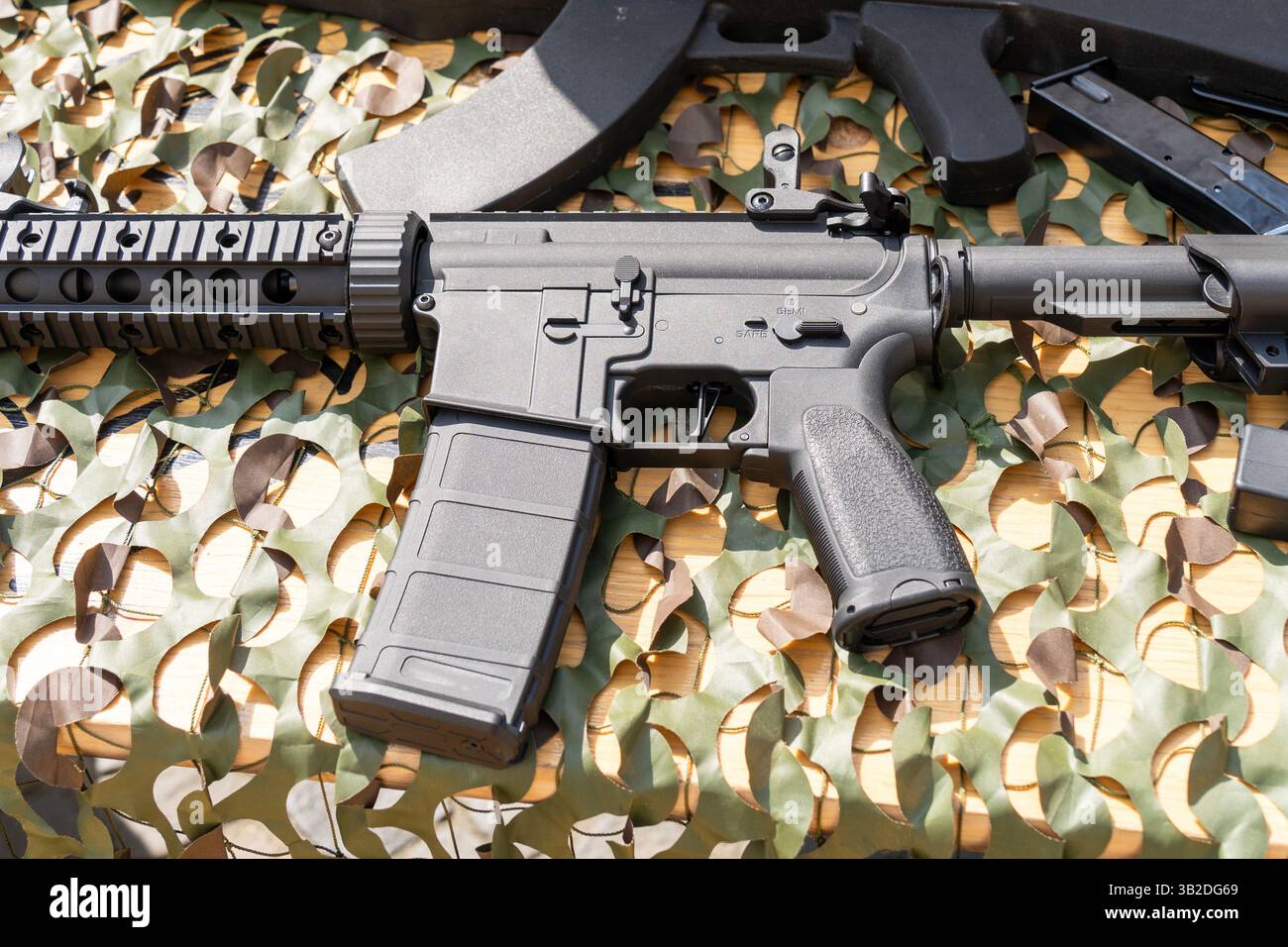 American black M4 automatic carbine on a camouflage table Stock Photo ...
