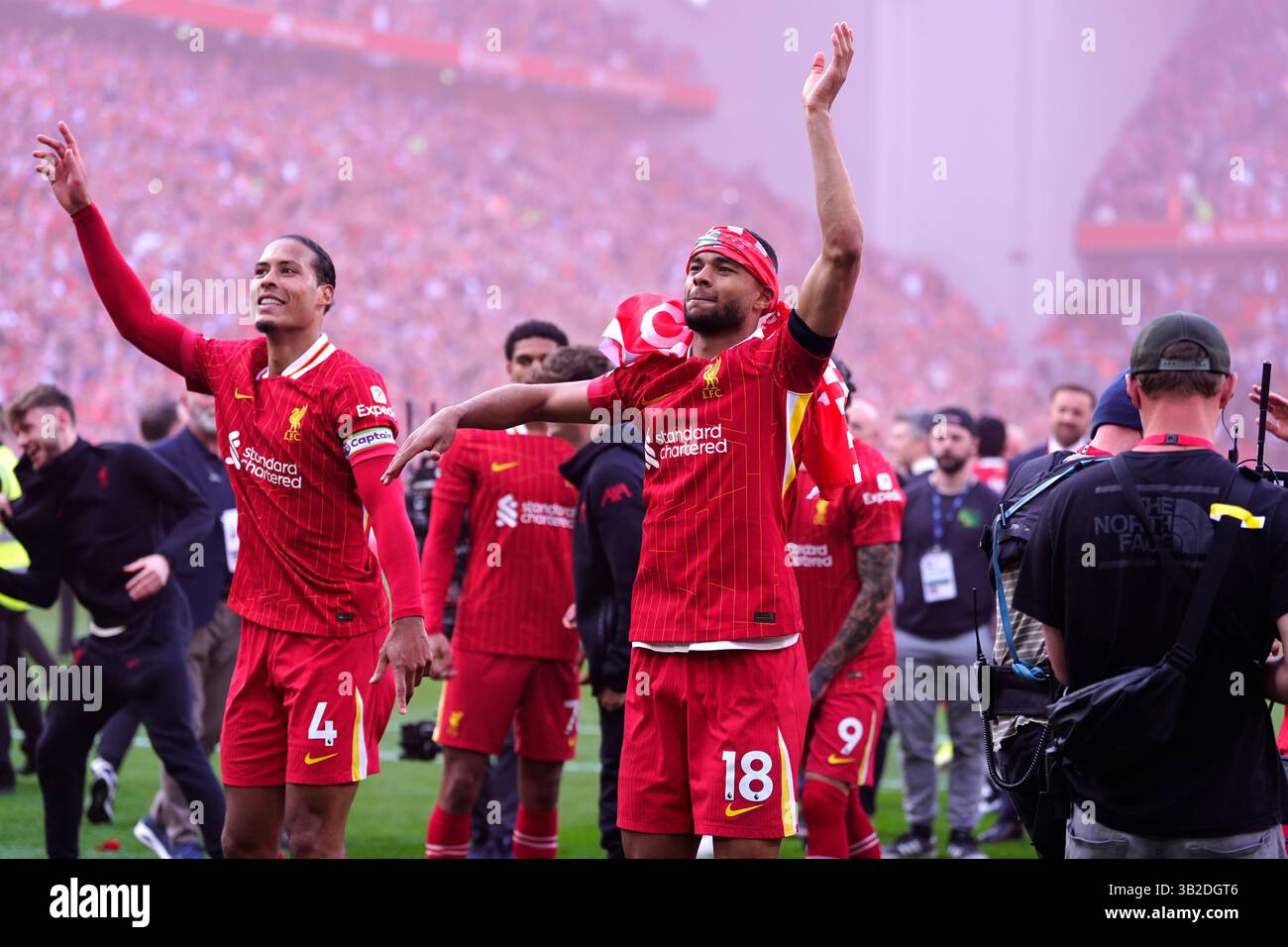 Liverpool's Virgil van Dijk (left) and Cody Gakpo celebrate victory and ...
