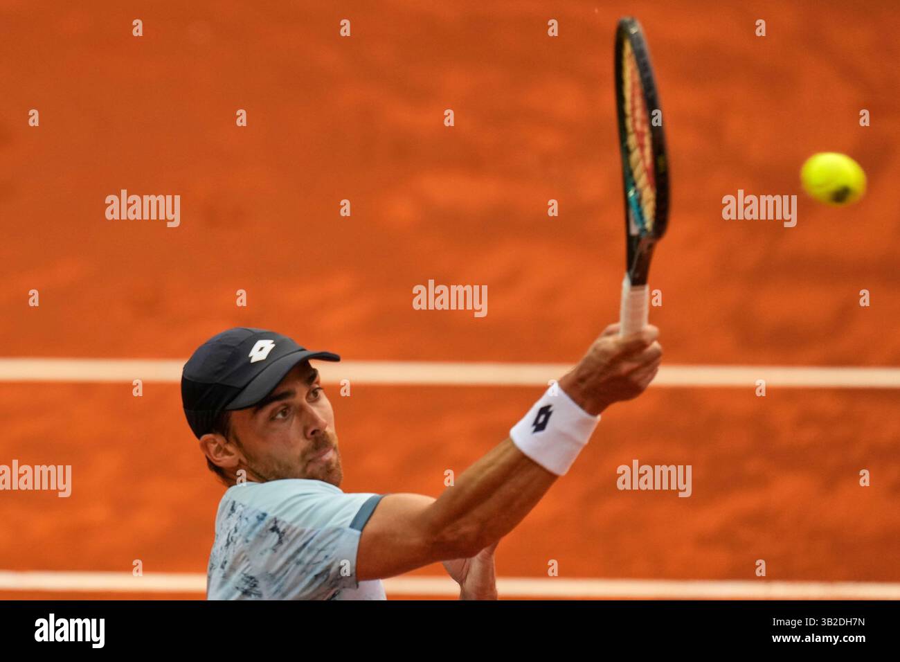 Benjamin Bonzi of France returns the ball during the Madrid Open tennis ...