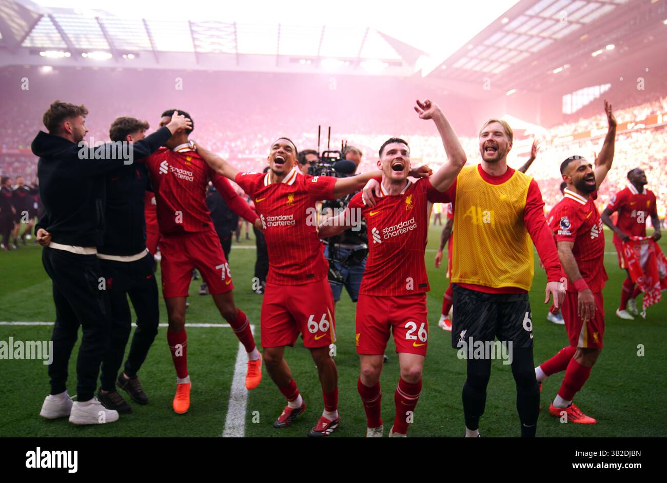 Liverpool players celebrate victory and the Premier League title ...