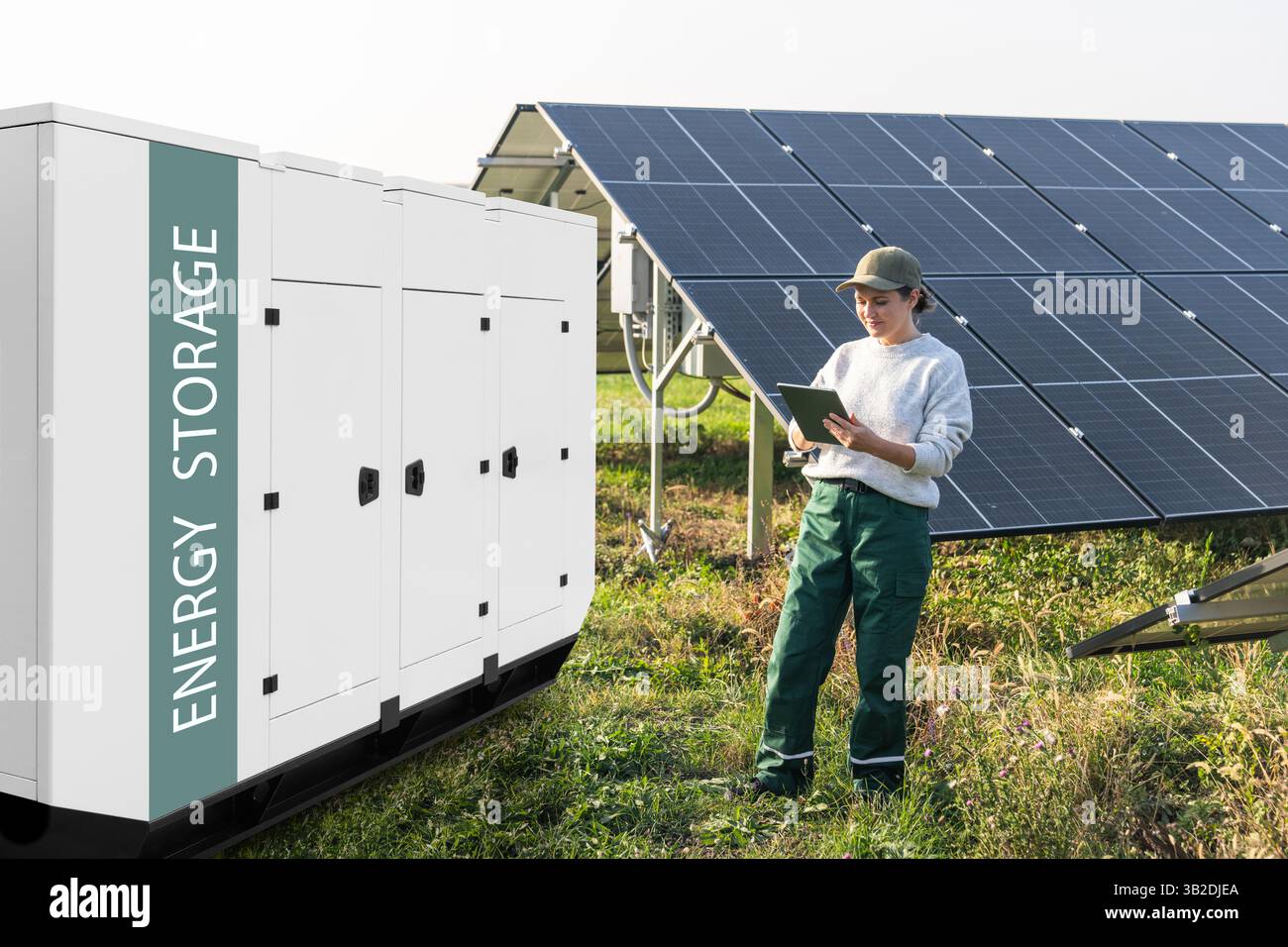 Farmer with digital tablet next to solar panels and energy storage ...