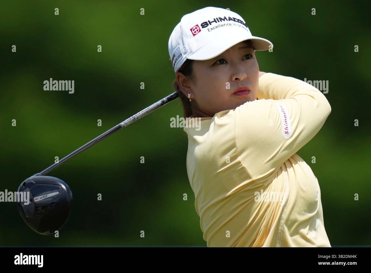 Mao Saigo, of Japan, hits from the fourth tee during the final round of ...