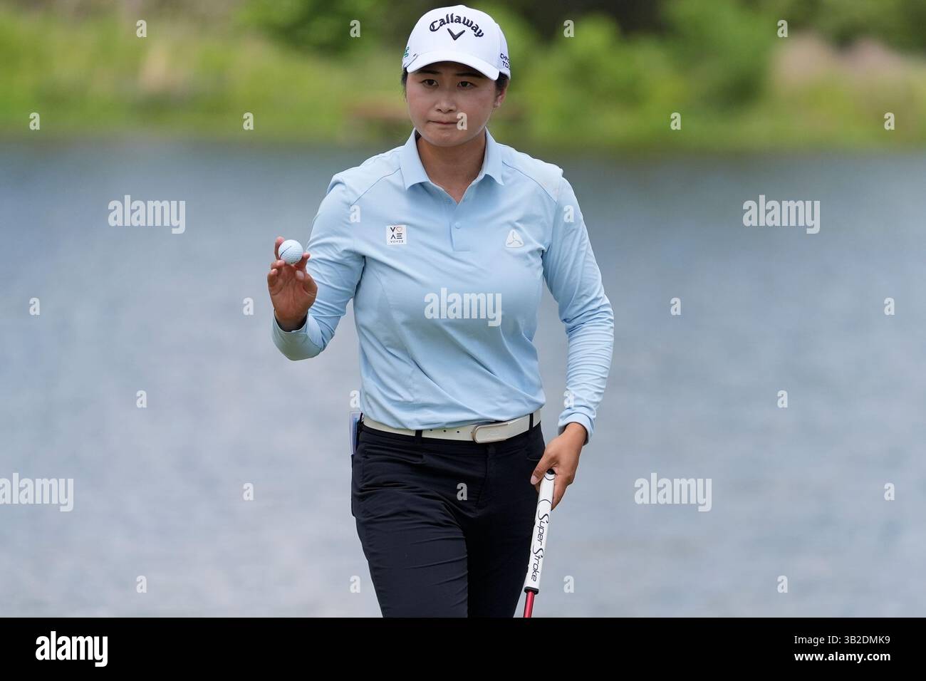 Yan Liu, of China, walks off ghe third green during the final round of the Chevron Championship ...