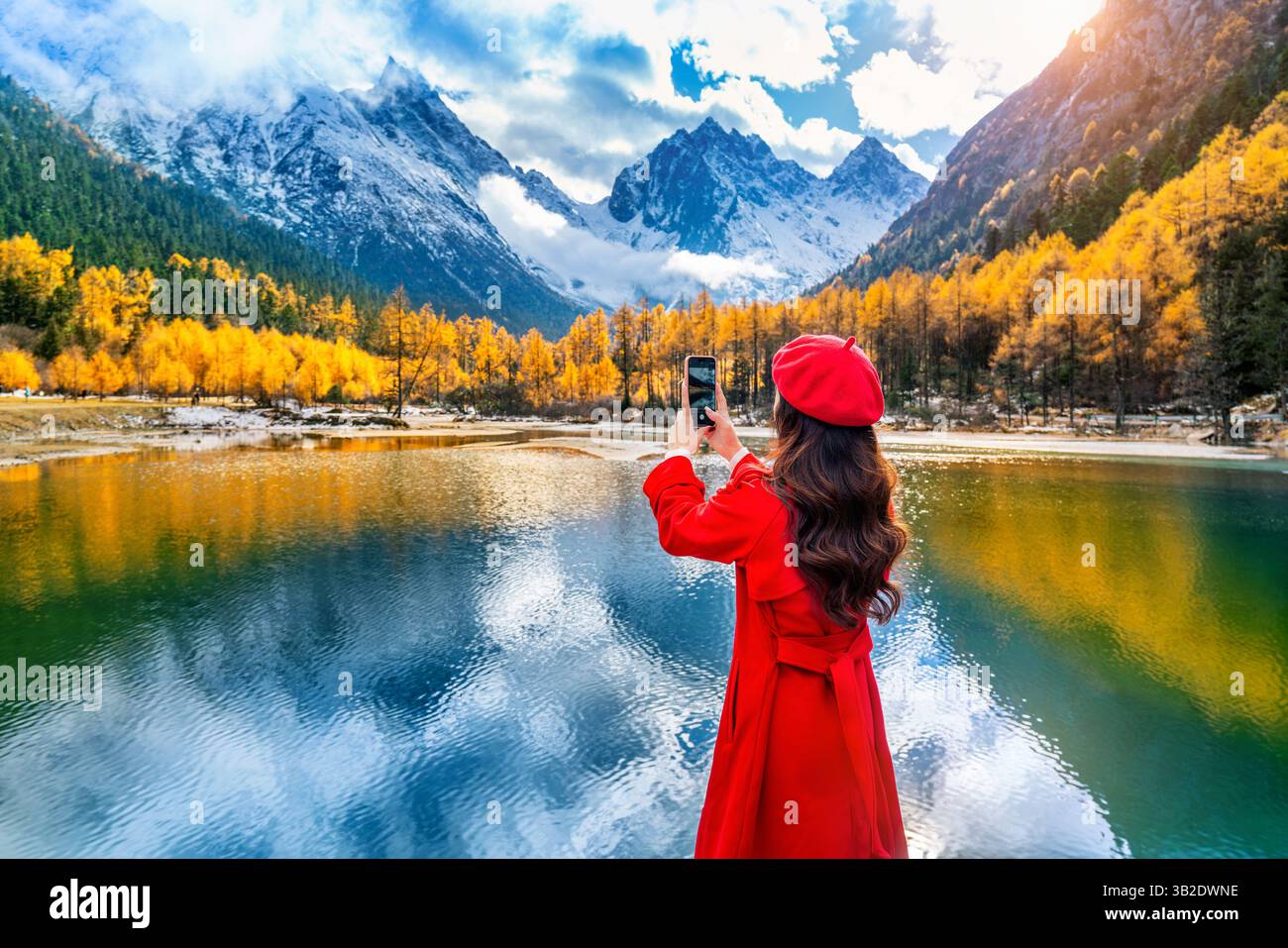 Tourist taking photo of Bipenggou in autumn, Chengdu in China Stock ...
