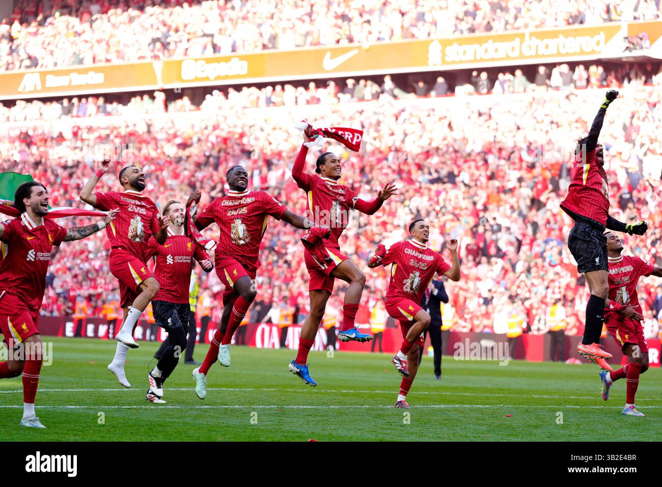 Liverpool players celebrate victory and the Premier League title ...
