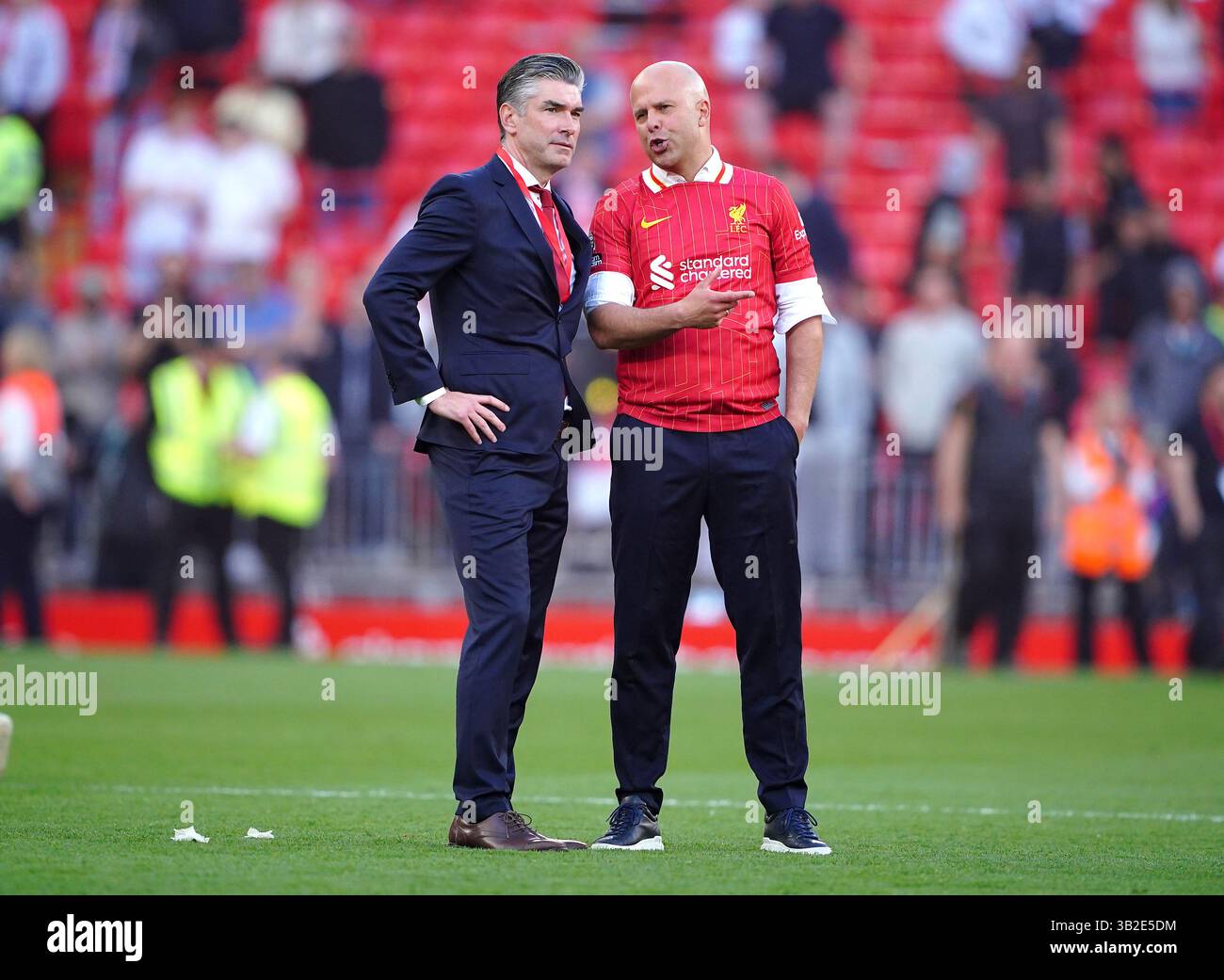 Liverpool manager Arne Slot (right) and sporting director Richard ...