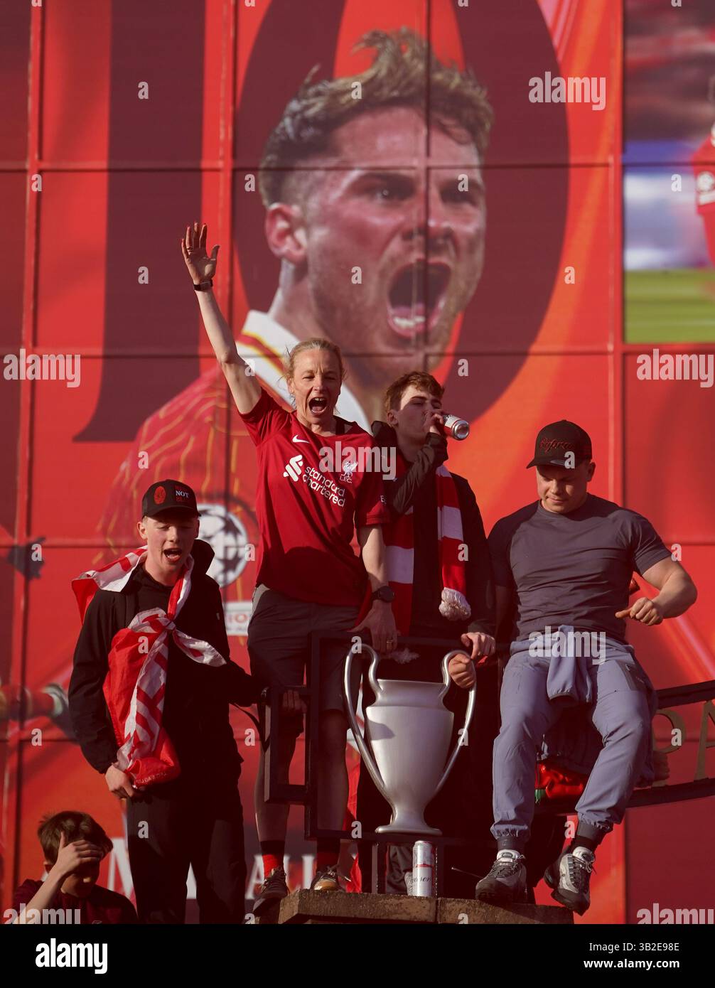 Liverpool fans celebrate victory in the Premier League outside Anfield ...