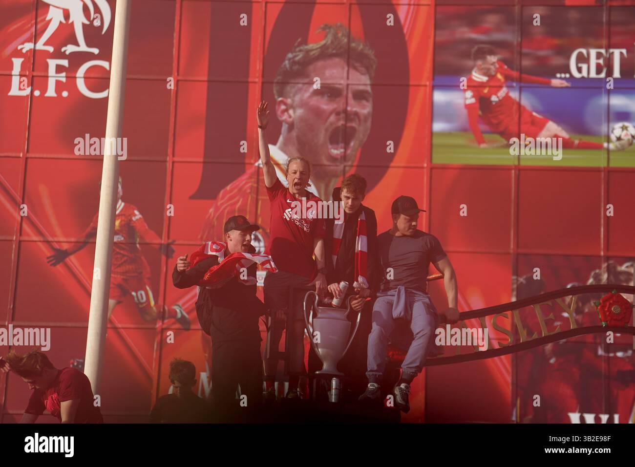 Liverpool fans celebrate victory in the Premier League outside Anfield ...