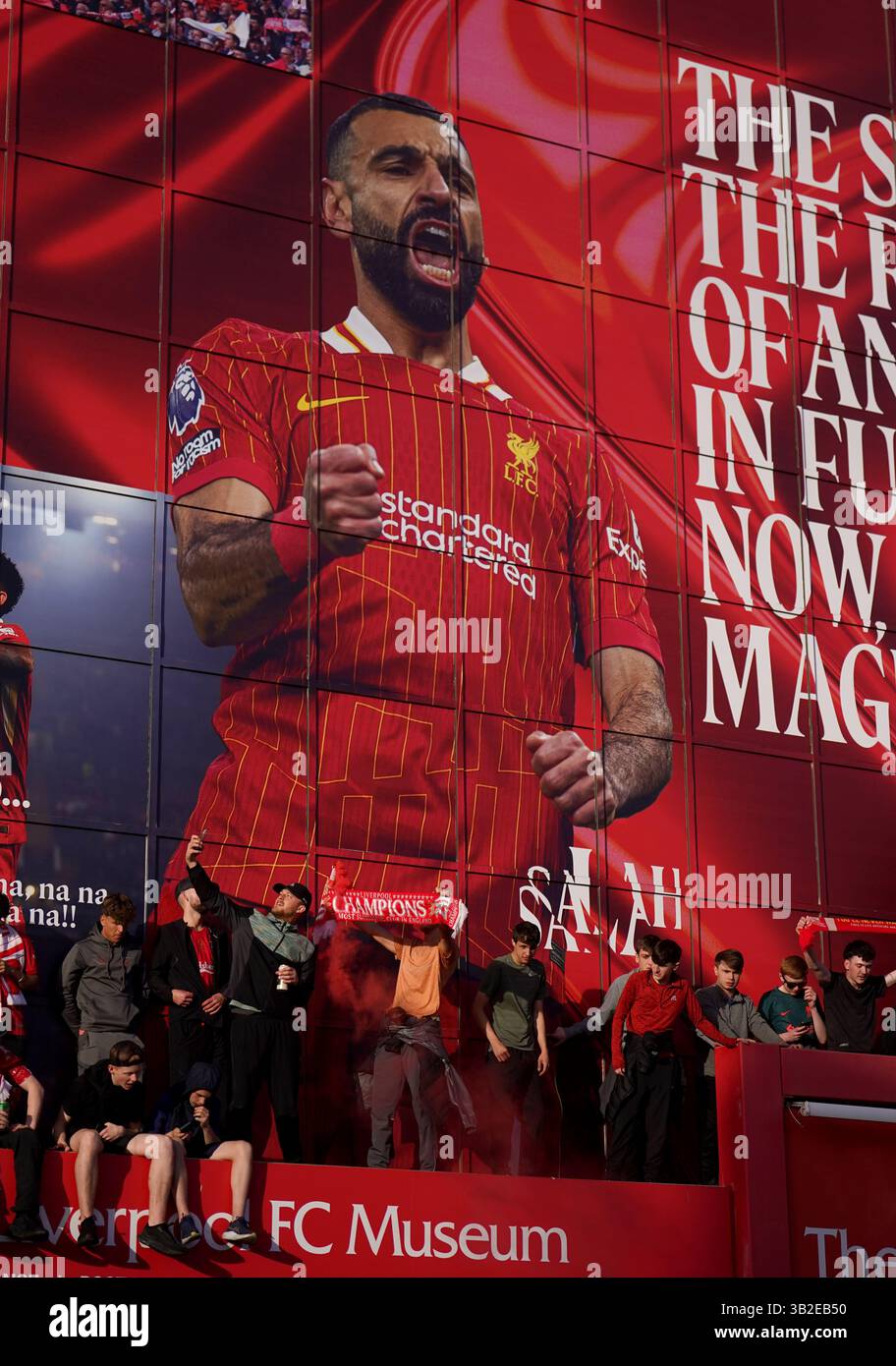 Liverpool fans celebrate victory in the Premier League outside Anfield ...