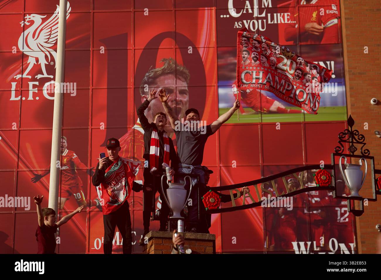 Liverpool fans celebrate victory in the Premier League outside Anfield ...