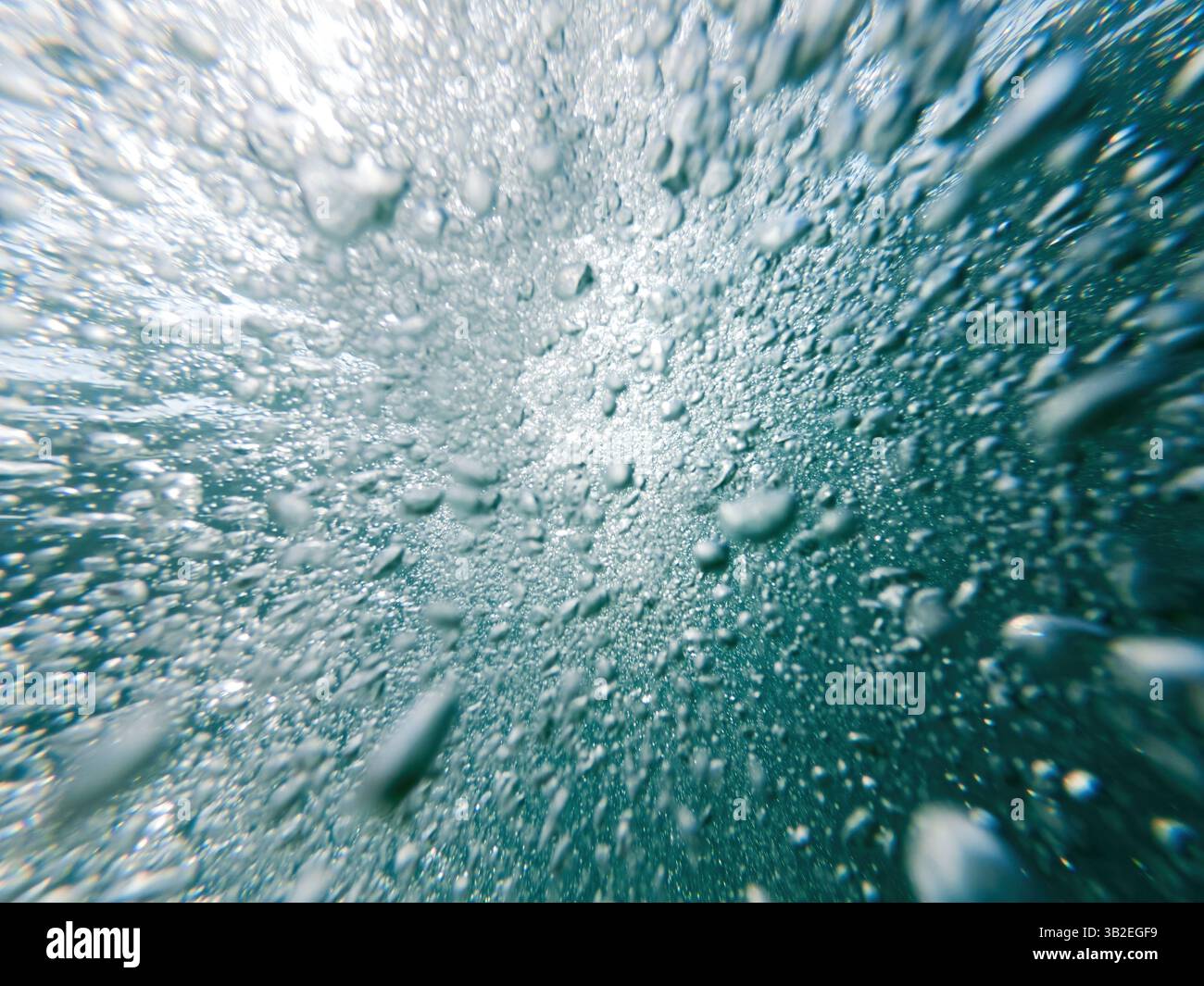 Underwater air bubbles in clean blue ocean water as natural background ...