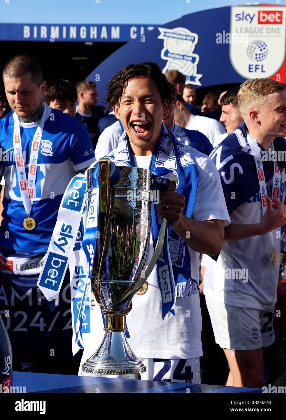 Birmingham City's Tomoki Iwata with the Sky Bet League One trophy after ...